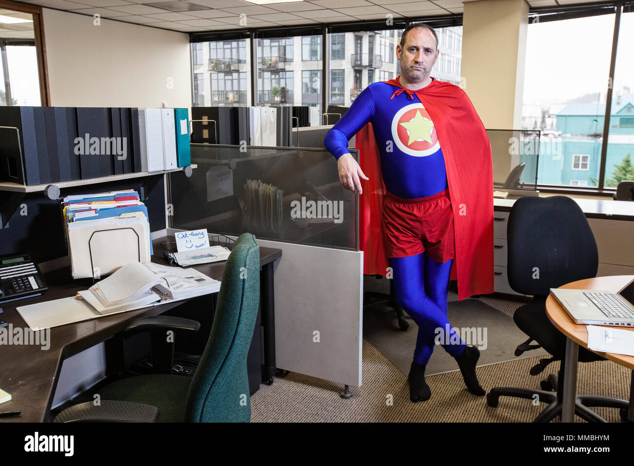 Caucasian middle aged man super hero in his cubicel office Stock Photo ...