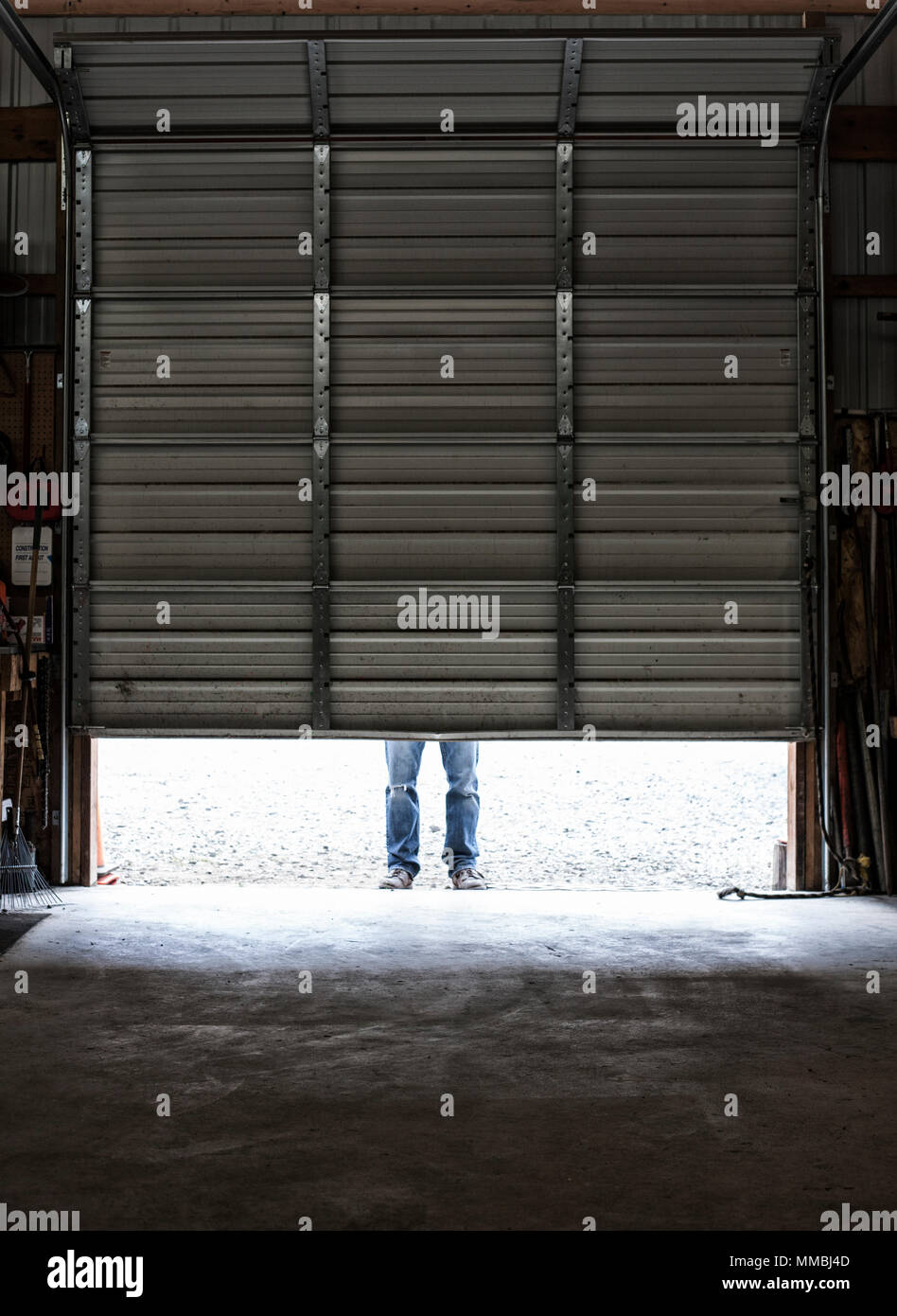 Employee coming to work walking in a loading dock doorway Stock Photo ...