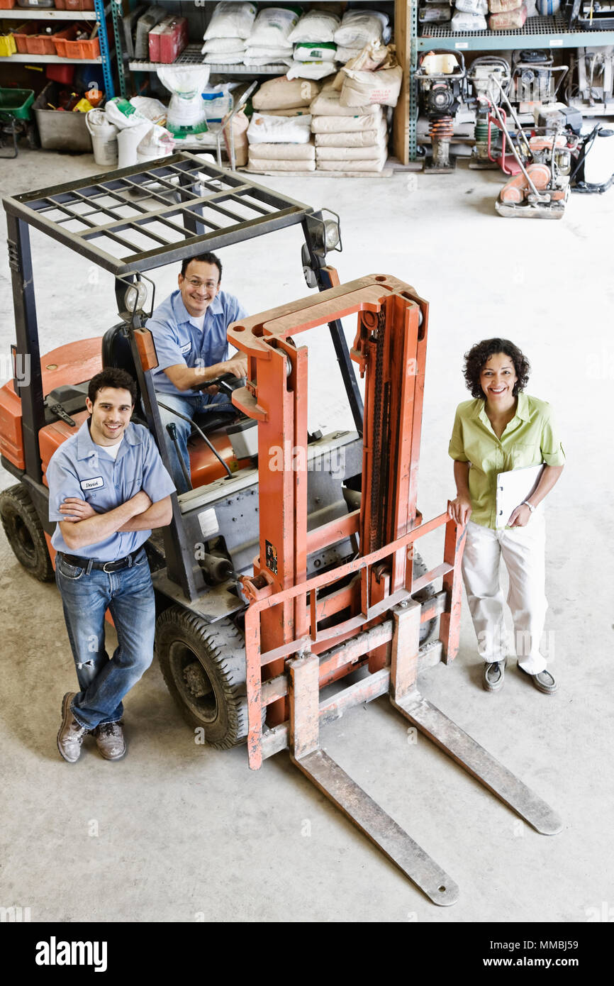 Mixed race team of workers and management person at a landscape company ...