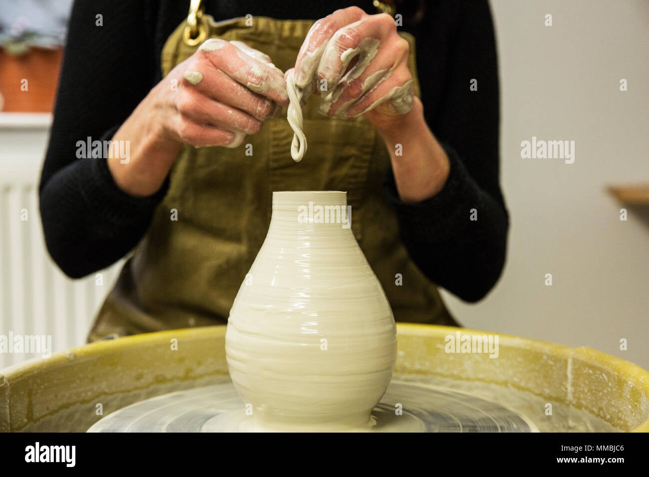 Woman shaping vase on potters hi-res stock photography and images - Alamy