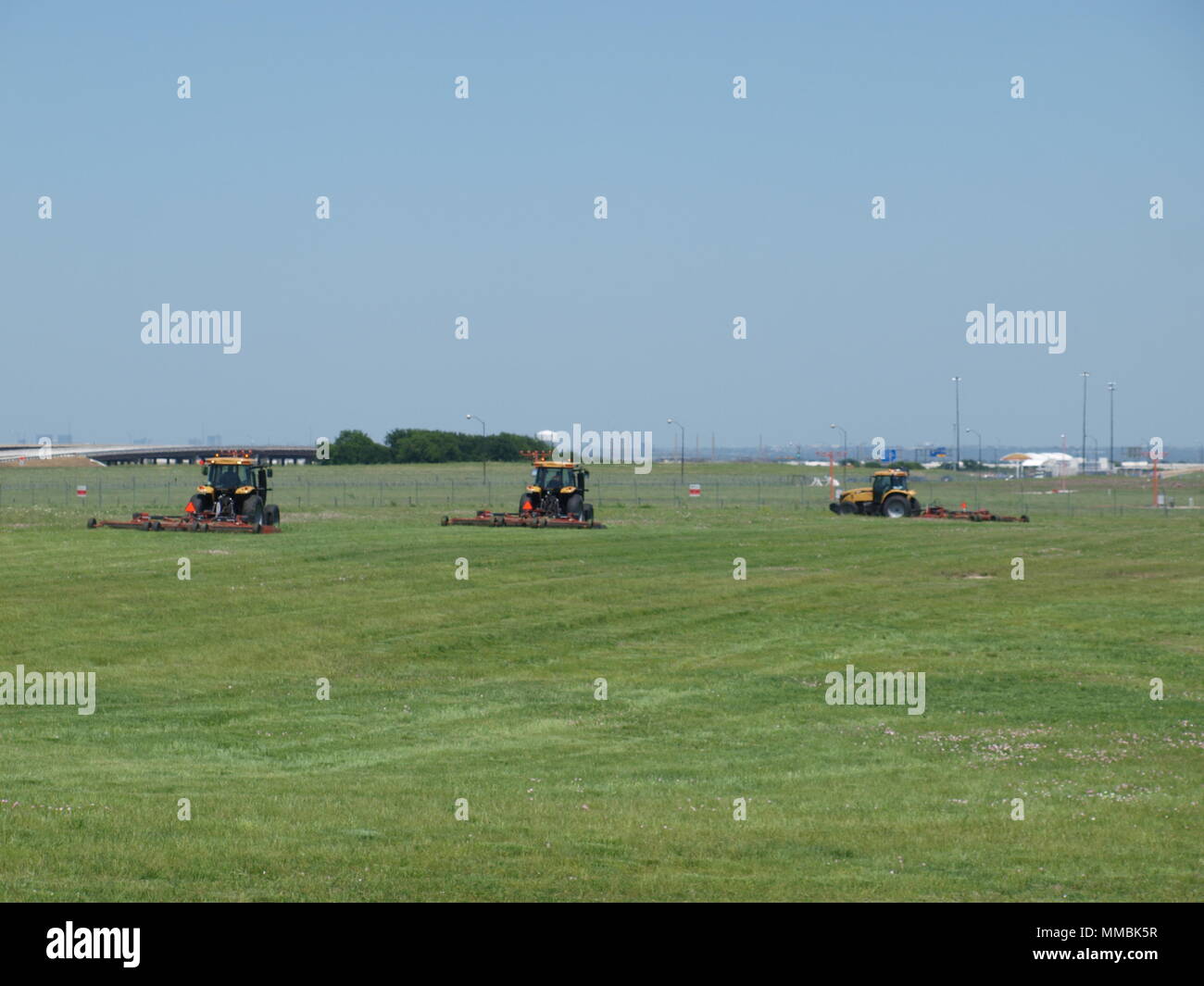 Cutting the Grass in Operational Field at DFW International Stock Photo ...
