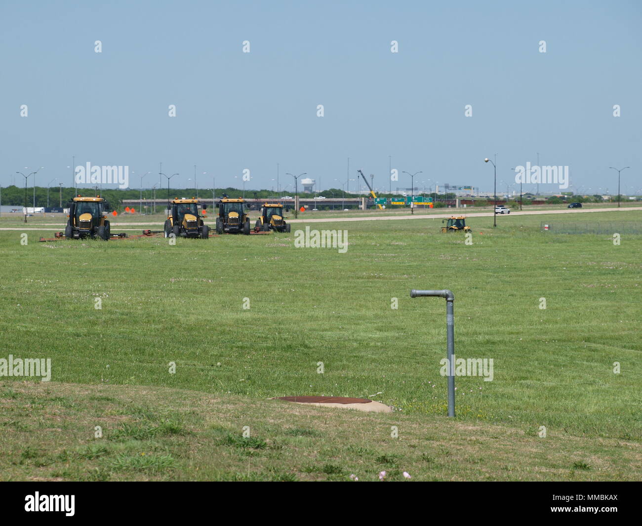 Cutting the Grass in Operational Field at DFW International Stock Photo ...