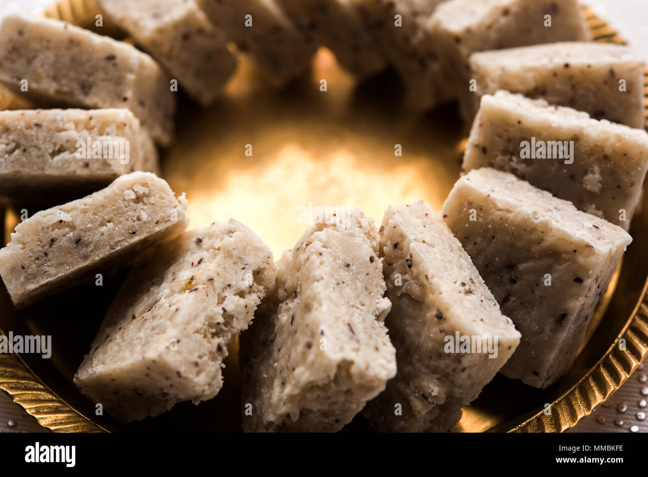 Fresh Nariyal Barfi / Coconut Burfi or Khobra Vadi, served in a bowl or ...