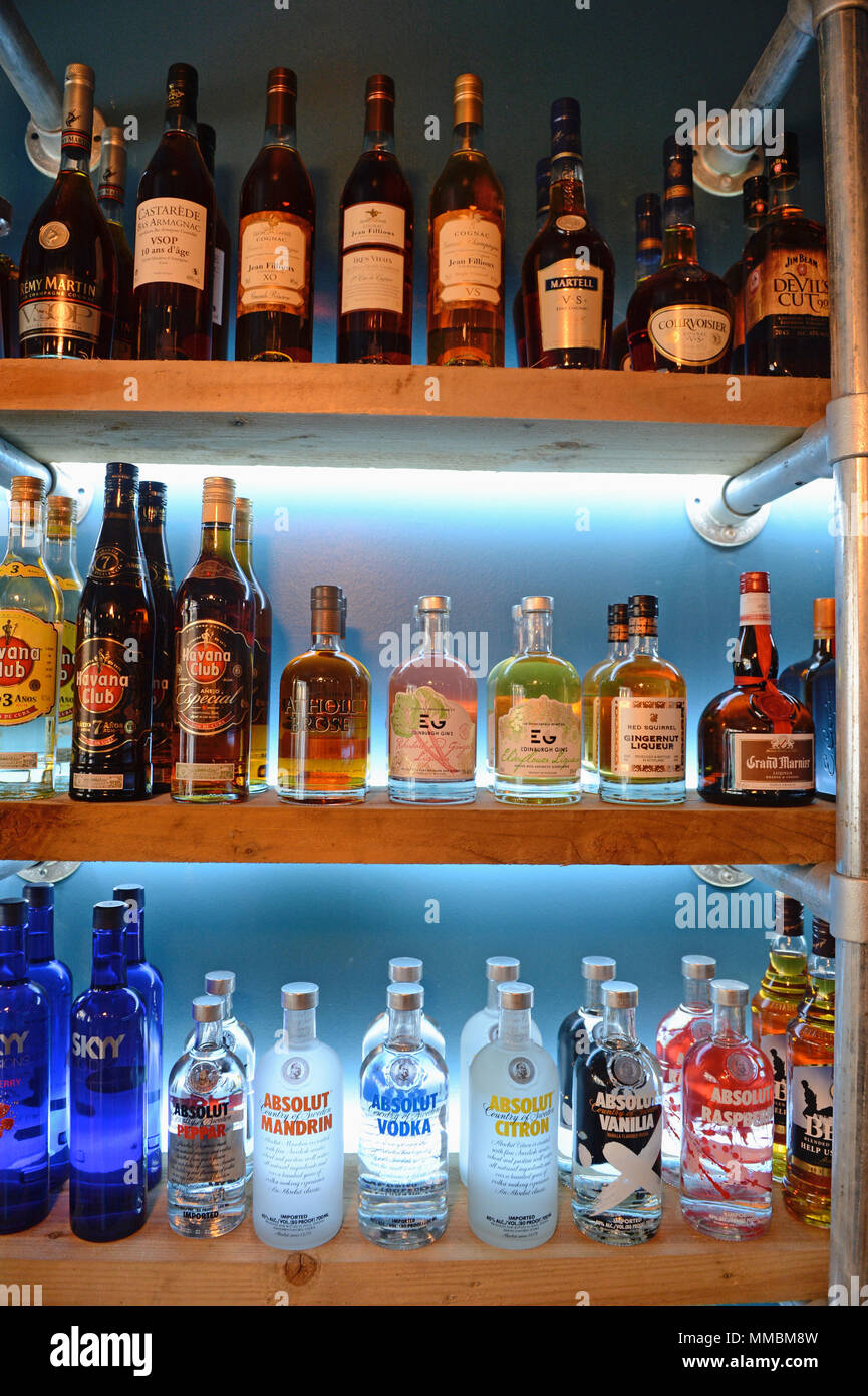 Inside a modern off license bottle shop with a variety of craft beers ...