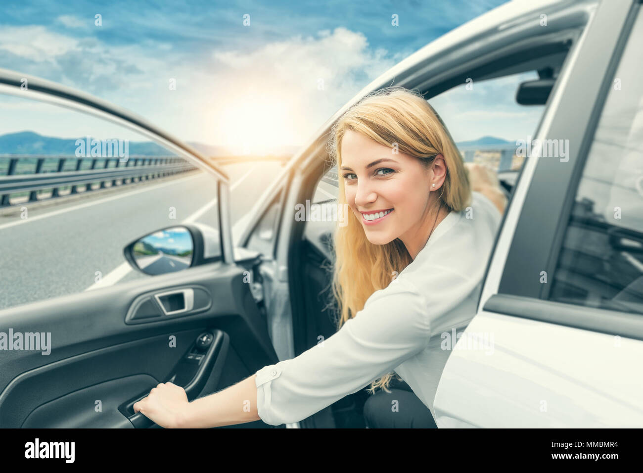 Blonde girl driving a car hi-res stock photography and images - Alamy
