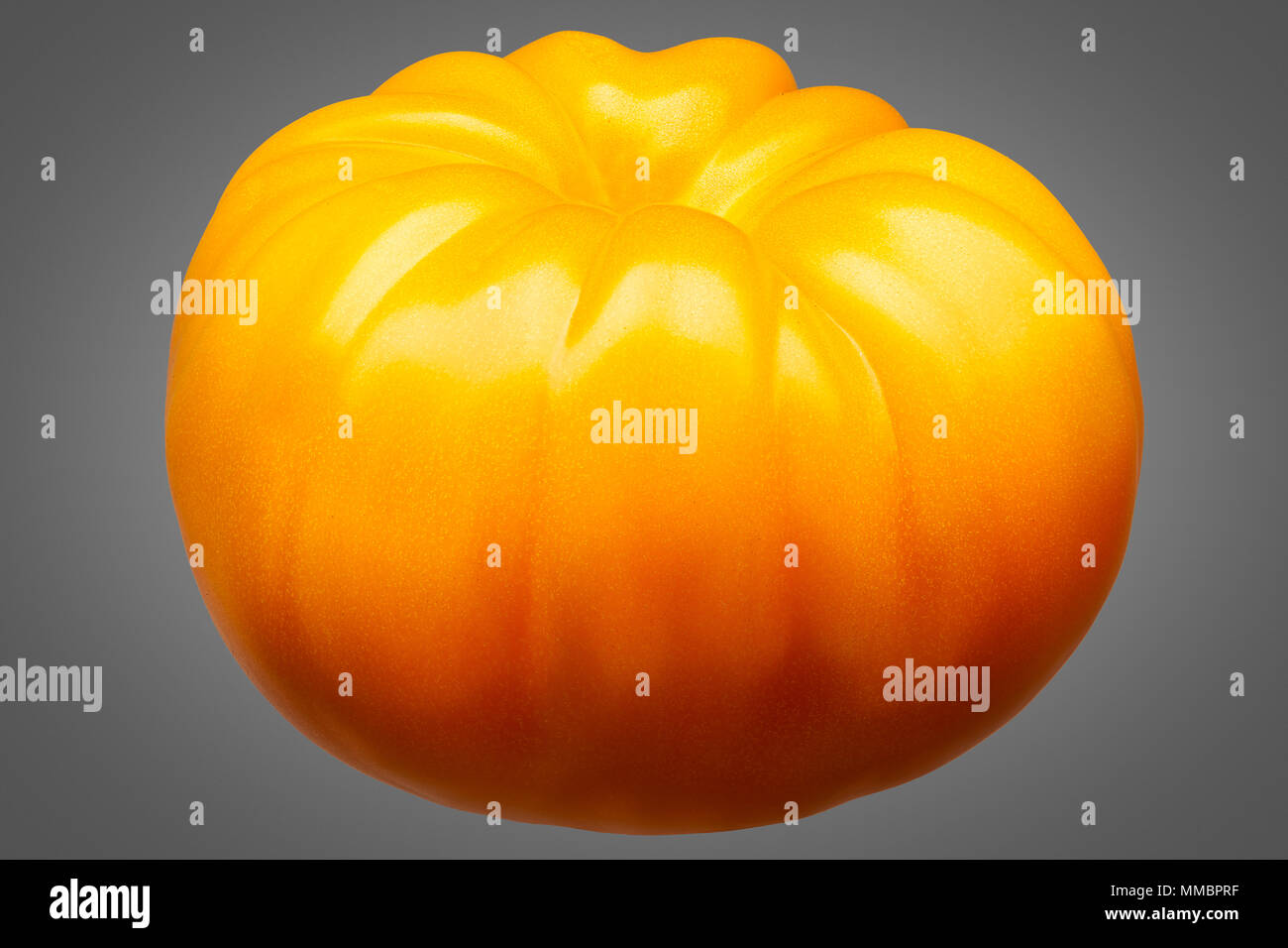 One whole big yellow tomato hi-res stock photography and images - Alamy
