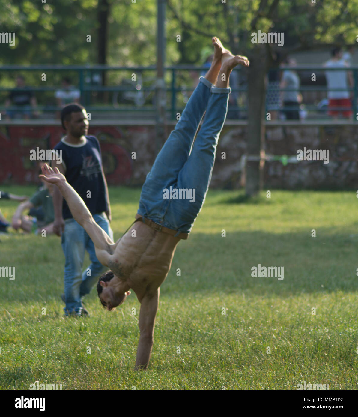 shirtless guy in denim handstanding Stock Photo - Alamy