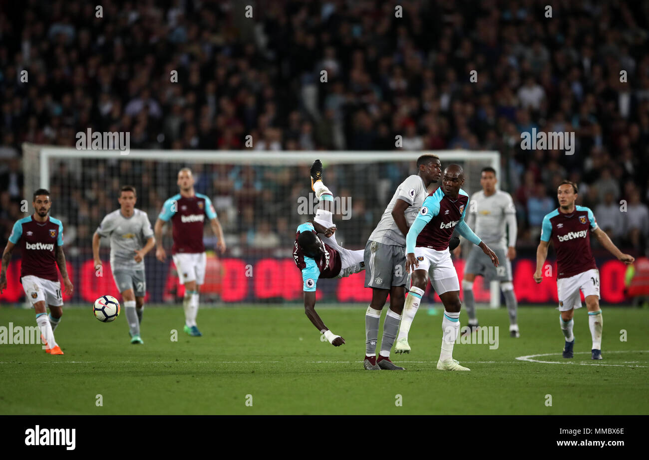West Ham United's Cheikhou Kouyate (centre) collides with Manchester ...