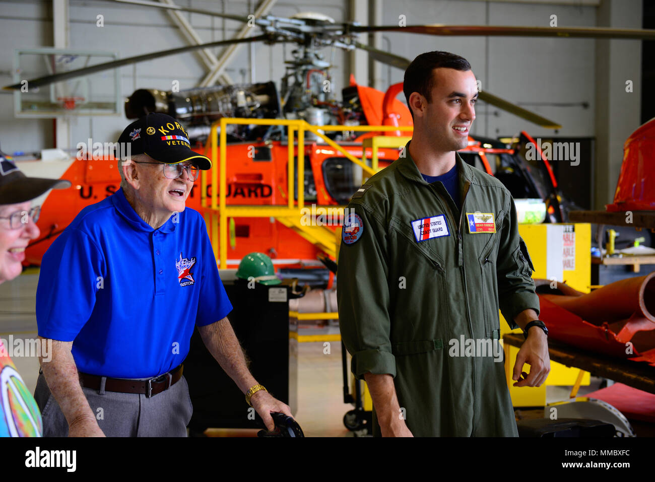 Andrew Blair, left, and Lt. j.g. Bradley Harbert, right, share stories ...