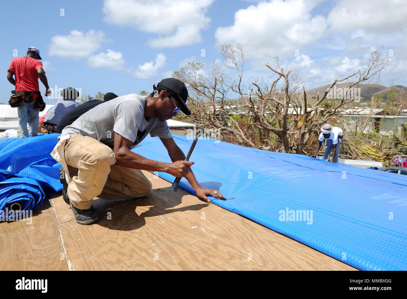 Fredericksted, St. Croix, USVI--Contractors work to put fiber ...