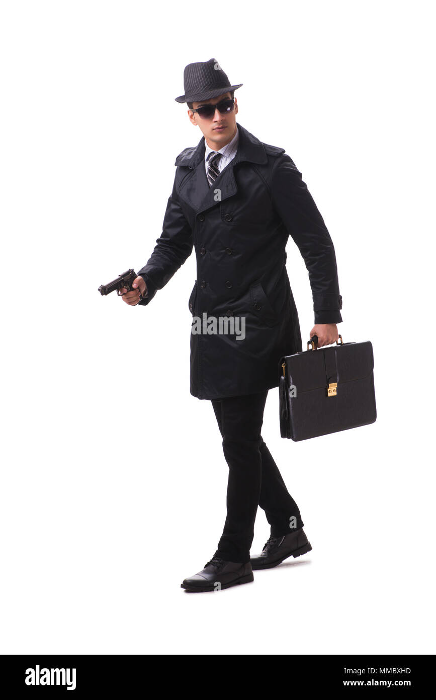 Man spy with handgun isolated on white background Stock Photo - Alamy