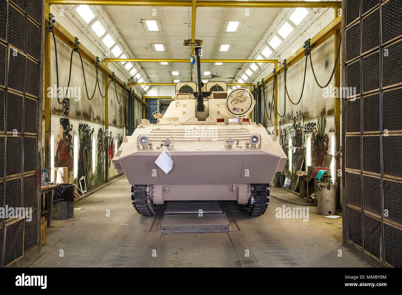 A M113A3/BMP-2 Opposing Forces Surrogate Vehicle stands in a paint ...