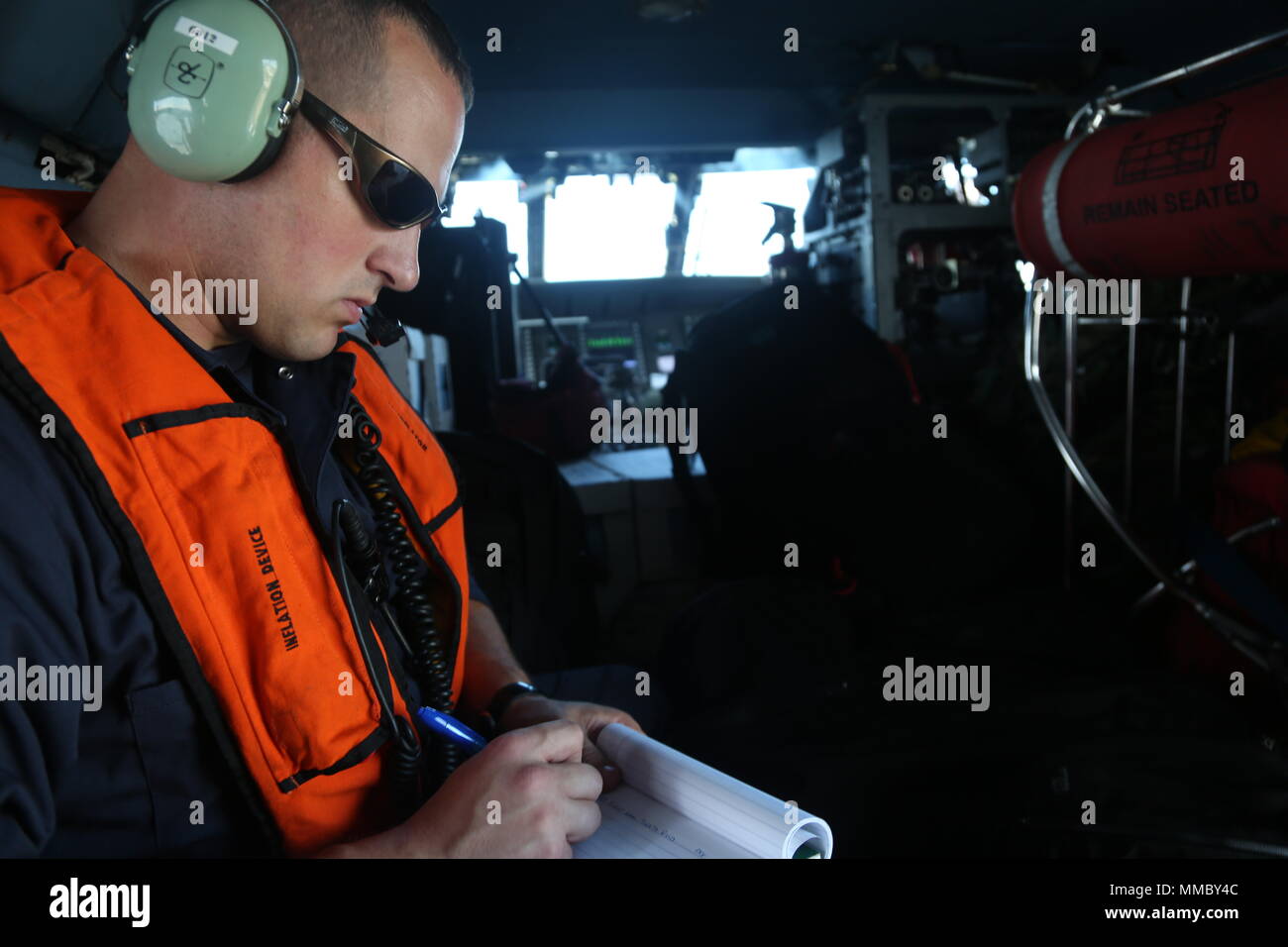 U.S. Coast Guard Petty Officer 2nd Class Kyle Graeber, assigned to the ...