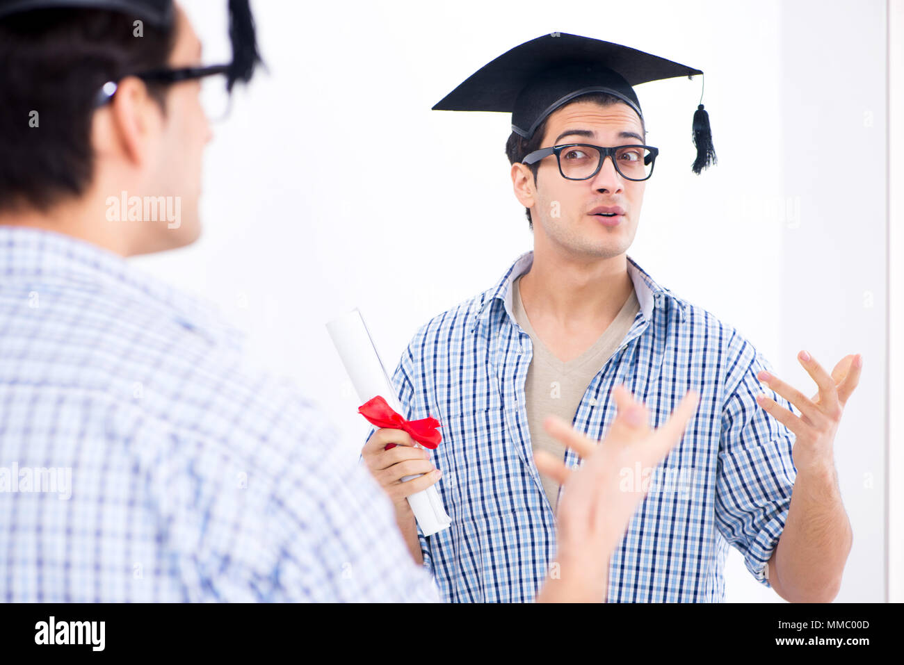 Young student planning graduation speech in front of mirror Stock Photo ...