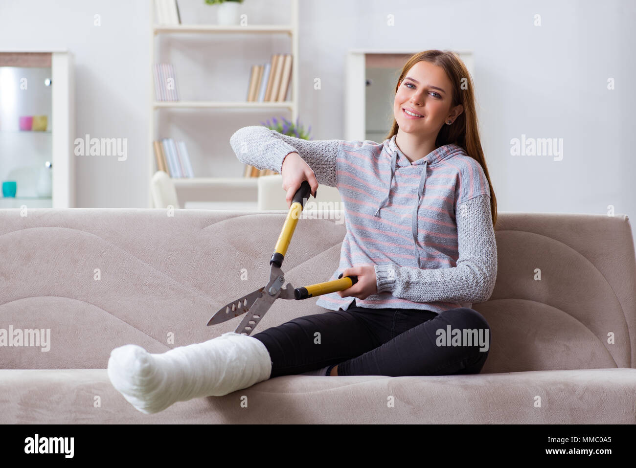 Young woman with broken leg at home Stock Photo - Alamy