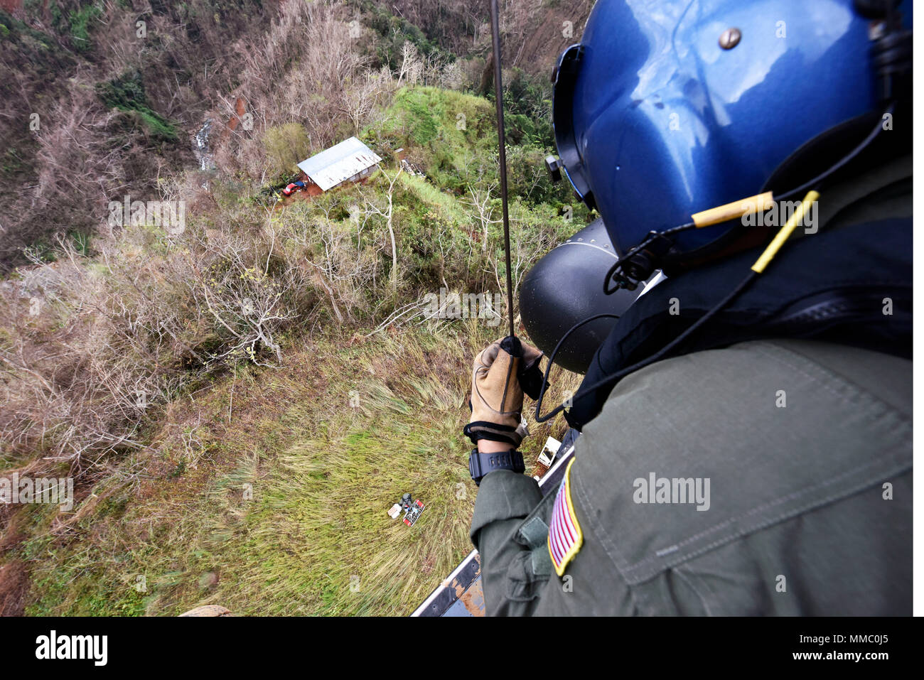 Coast Guard Petty Officer 3rd Class Ron Carrasquillo, a helicopter ...