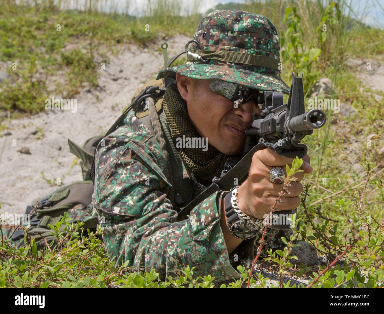 Philippine Marine Sgt. Dido Paloma, a rifleman with Alpha Company, 5th ...