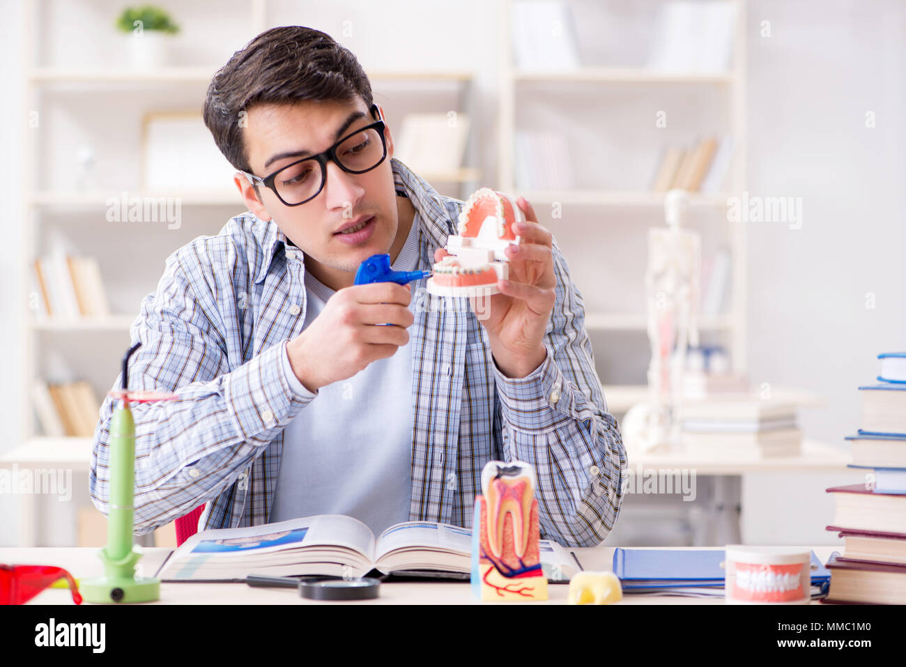 Medical student learning dentistry in classroom Stock Photo - Alamy