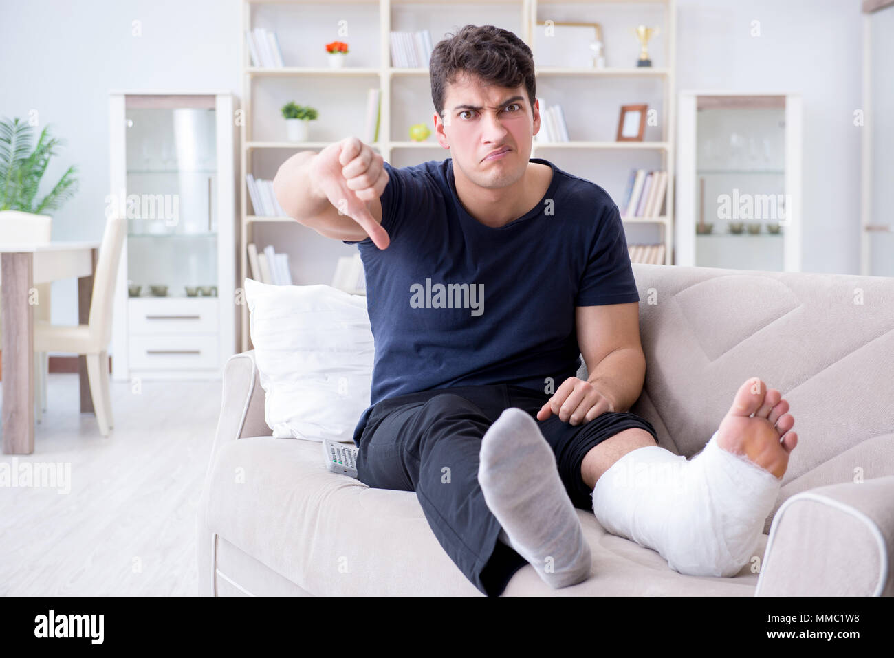 Man with broken leg recovering at home Stock Photo - Alamy