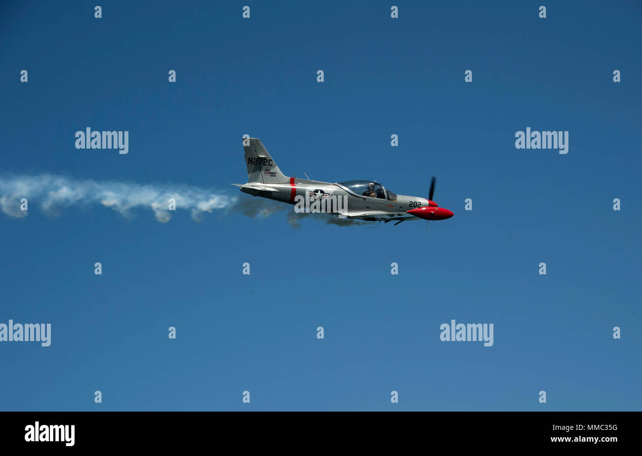 An Air Combat USA Marchetti SF260 leaves a vape trail during an aerial ...