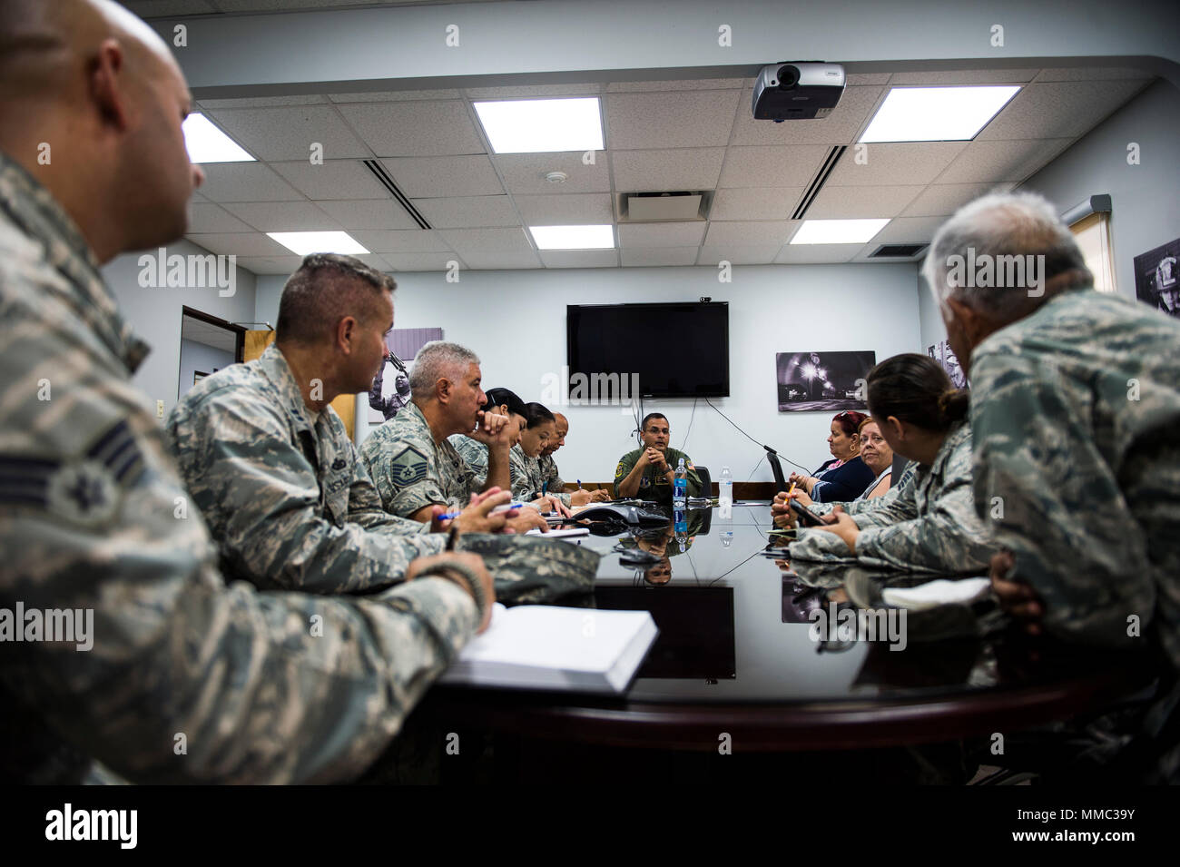 Lt. Col. Humberto Pabon, center, 156th Airlift Wing vice commander ...