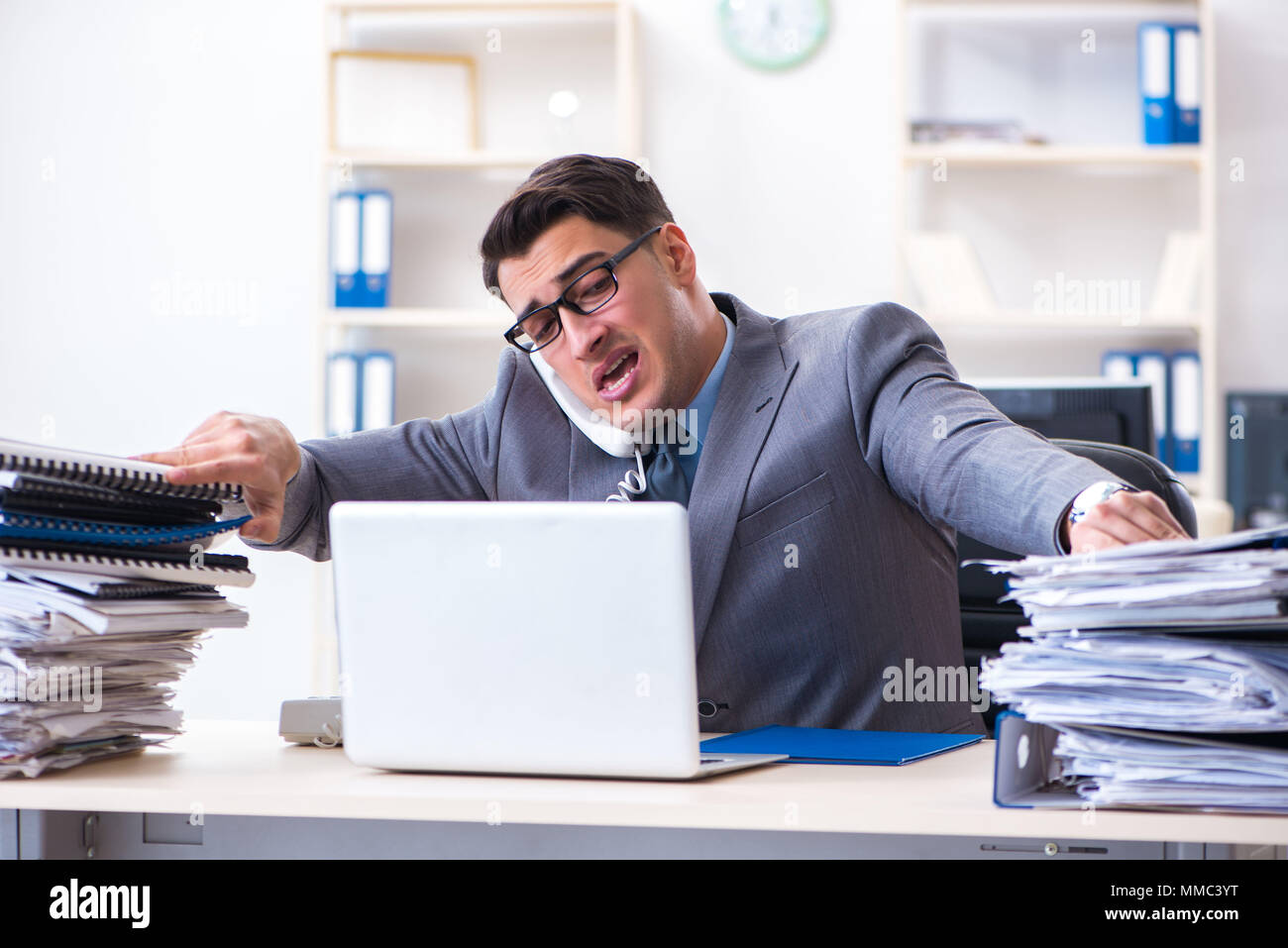 Desperate sad employee tired at his desk in call center Stock Photo - Alamy