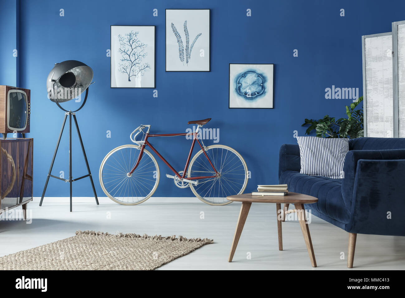 Spacious blue loft interior designed in retro style Stock Photo - Alamy