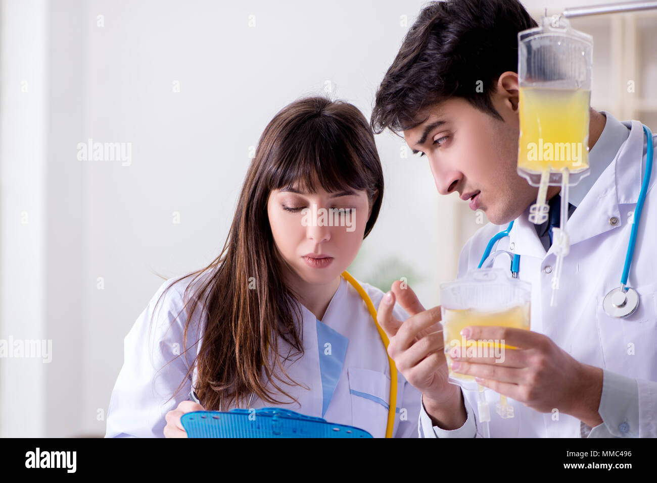 Two doctors discussing plasma and blood transfusion Stock Photo - Alamy
