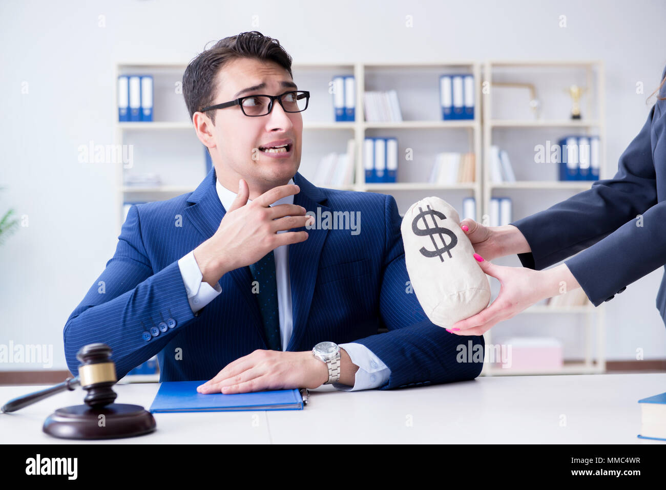 Judge in bribe concept with money Stock Photo - Alamy