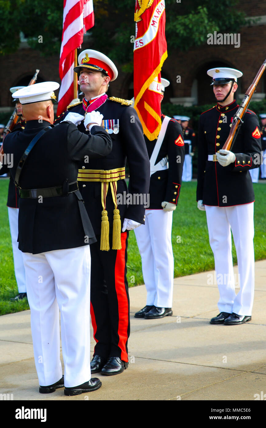 The Commandant of the Marine Corps, Gen. Robert B. Neller, awards the ...