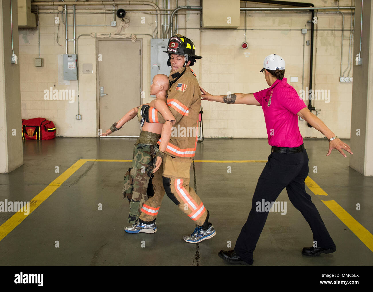 A participant carries a victim during the eighth annual Fire Prevention ...