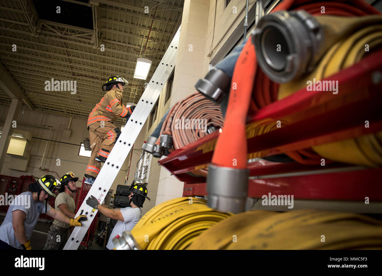 A participant climbs to the top of the ladder during the eighth annual ...