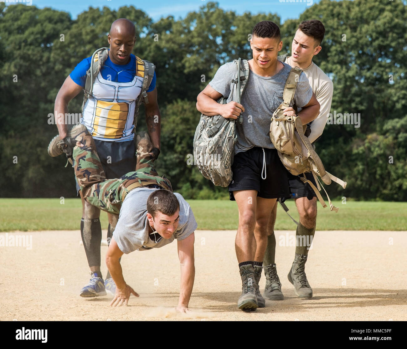 Four GORUCK Light members of team Alpha compete in the wheelbarrow race Oct. 6, 2017, at ...