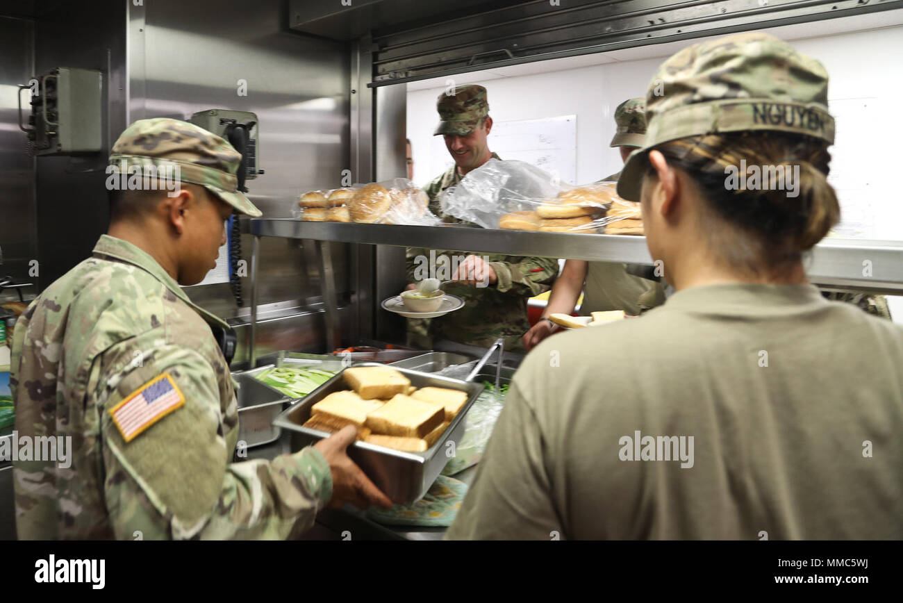 U.S. Army Sgt. James Munar, a Pomona, California native and a culinary ...