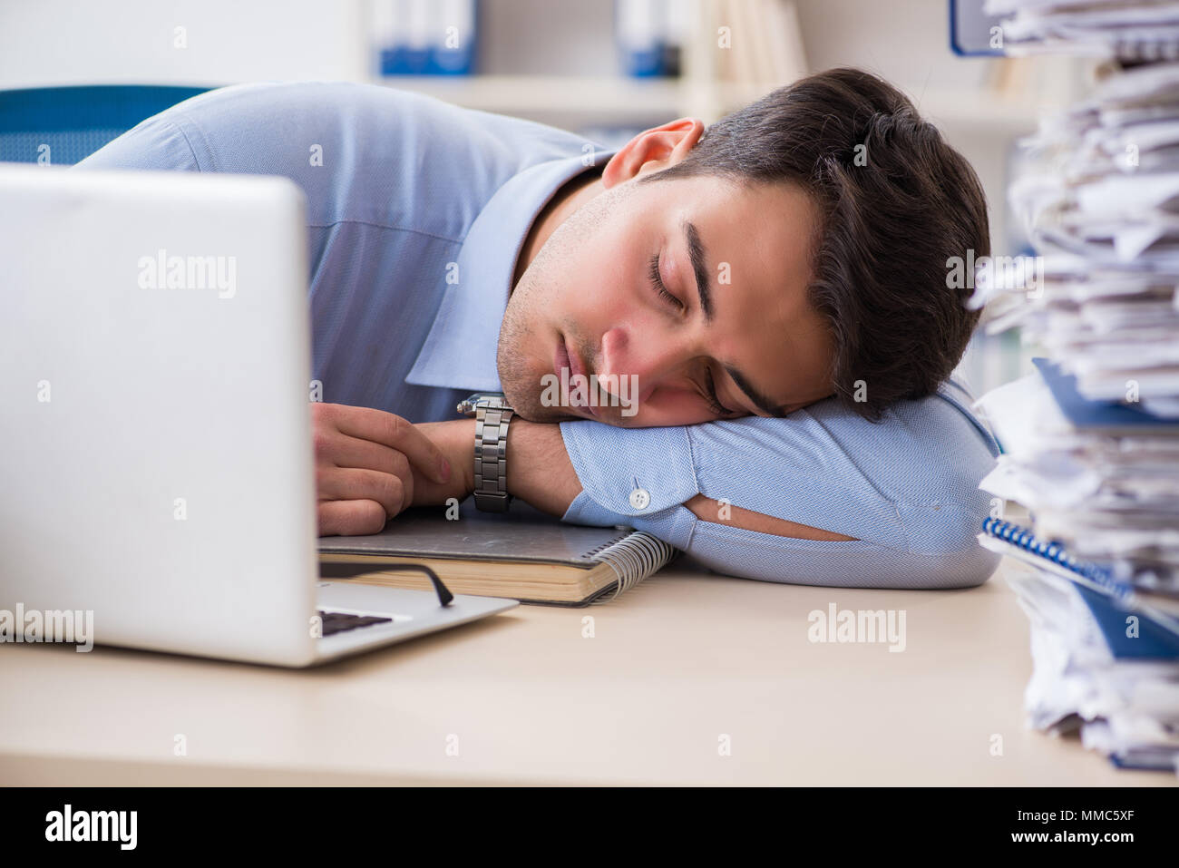 Extremely busy businessman working in office Stock Photo - Alamy