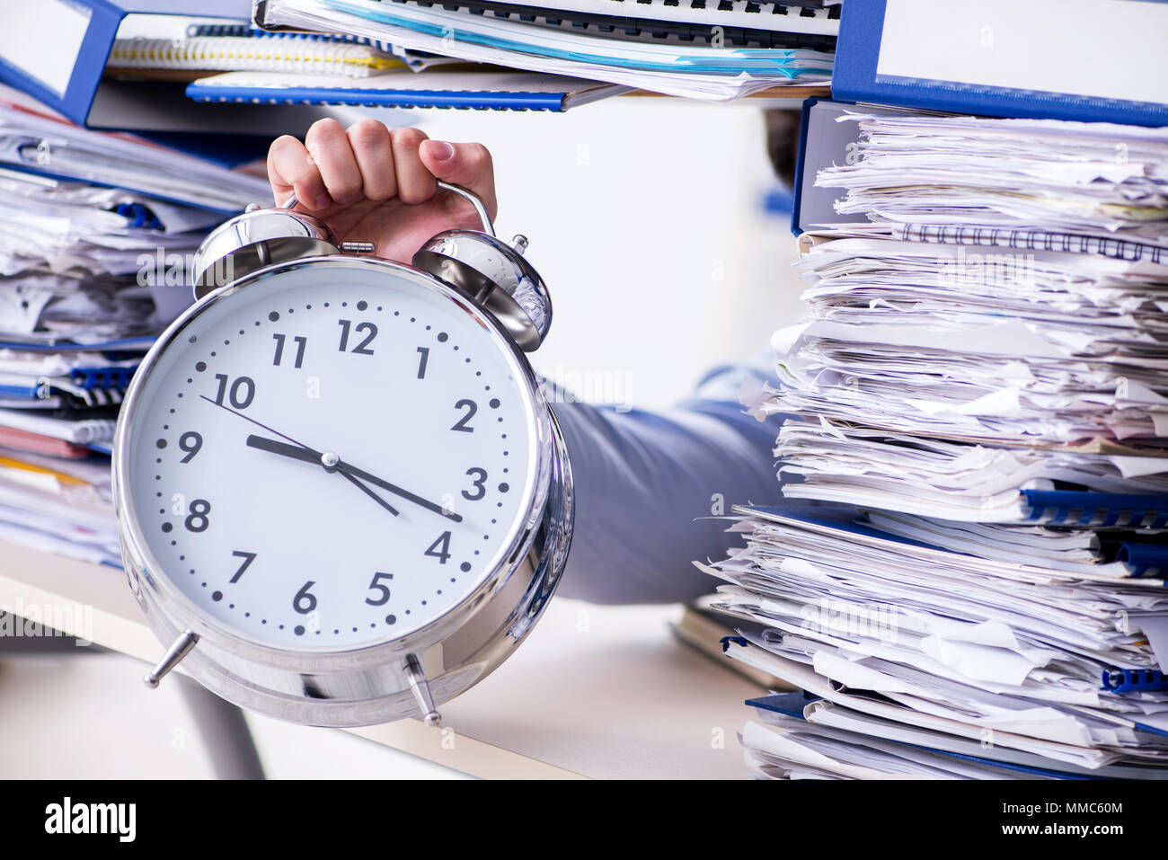 Extremely busy businessman working in office Stock Photo - Alamy