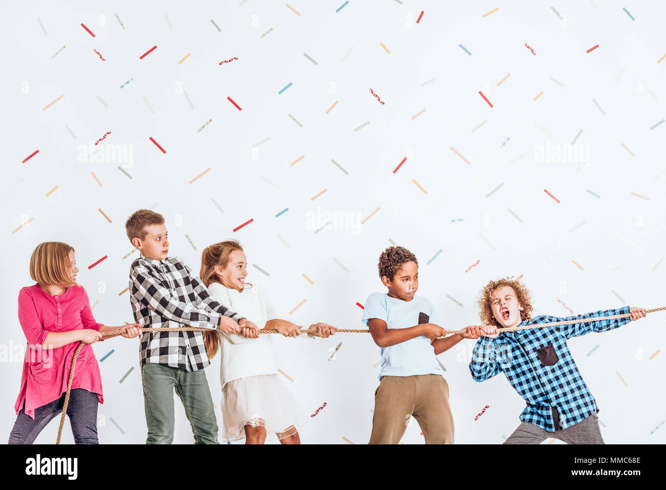Kids pulling rope hi-res stock photography and images - Alamy