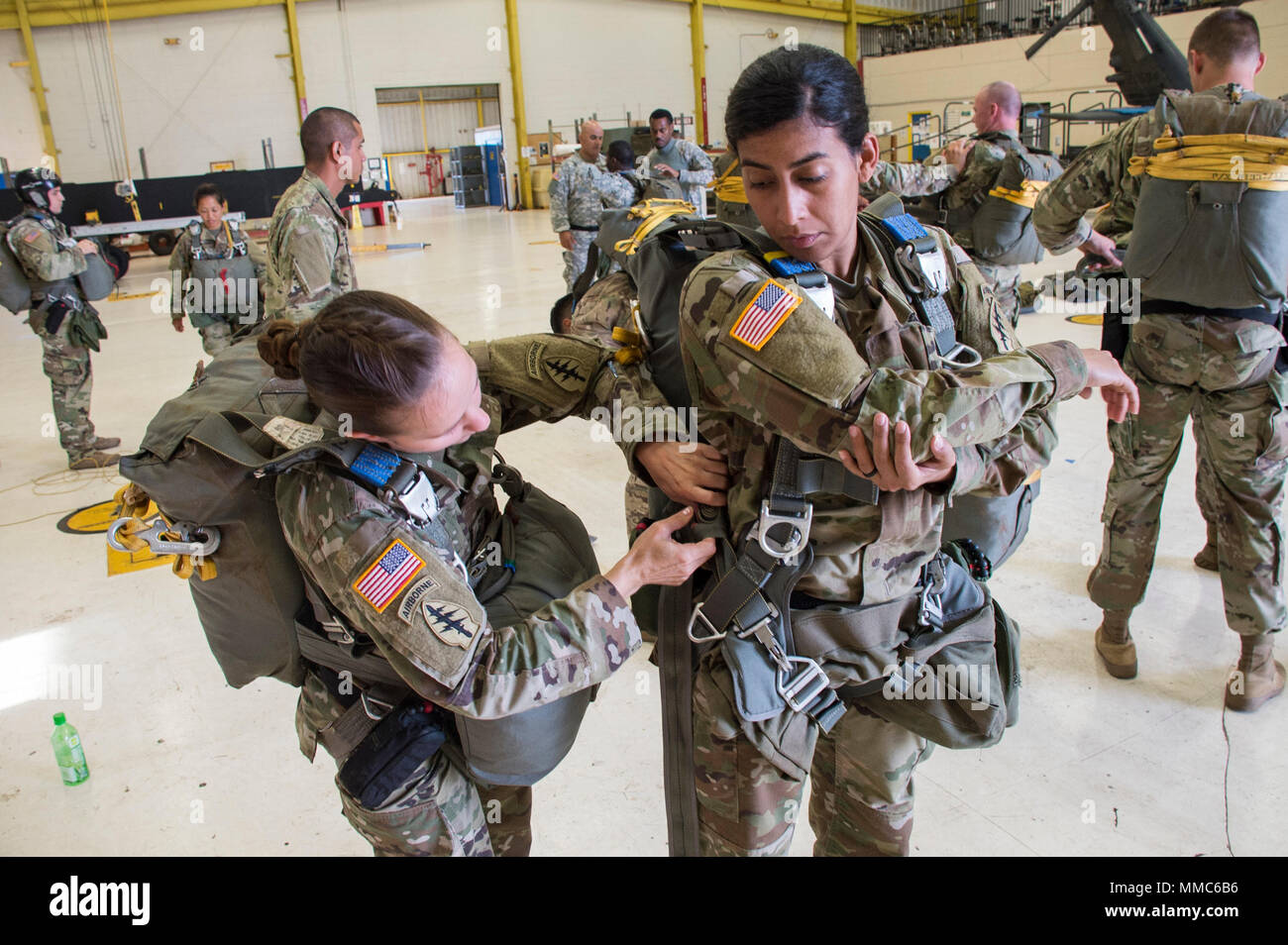 WHEELER ARMY AIRFIELD, Hawaii – Staff Sgt. Jessica Suarez, assists Spc ...
