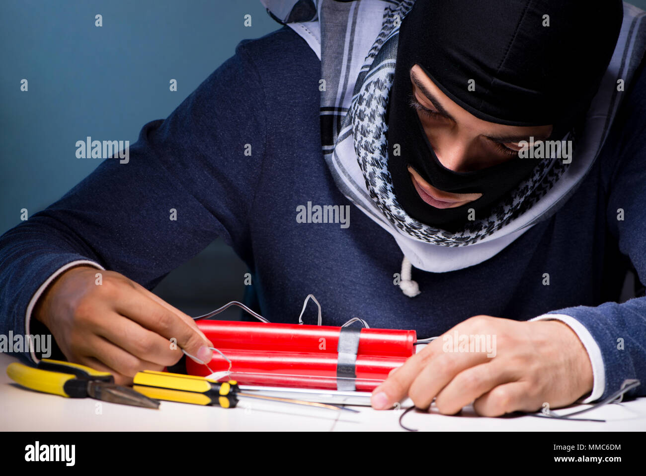 Terrorist bomber preparing dynamite bomb Stock Photo - Alamy