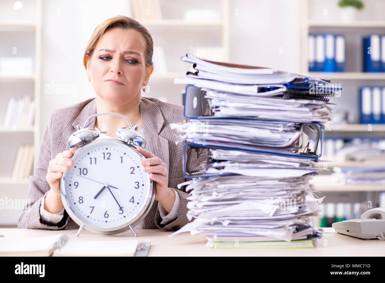 Businesswoman workaholic trying to finish urgent paperwork Stock Photo ...