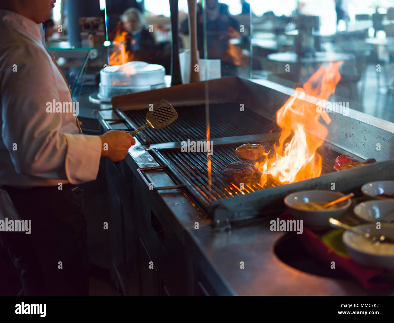 Master chef cooking delicious grilled meat steak with vegetables on a ...