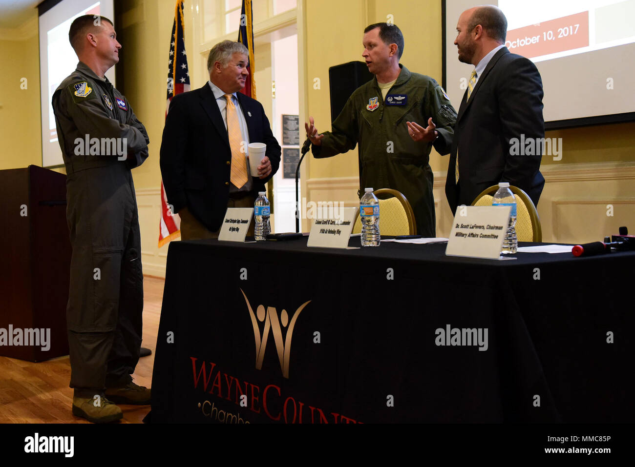 Col. Christopher Sage, 4th Fighter Wing commander, center, discusses ...