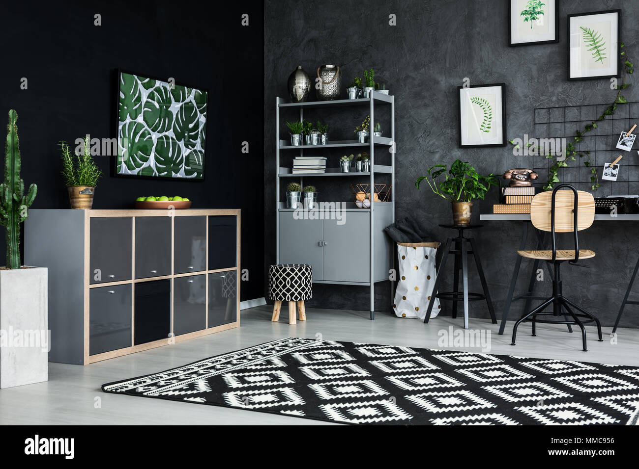 Room corner of modern flat with cyan wall Stock Photo - Alamy