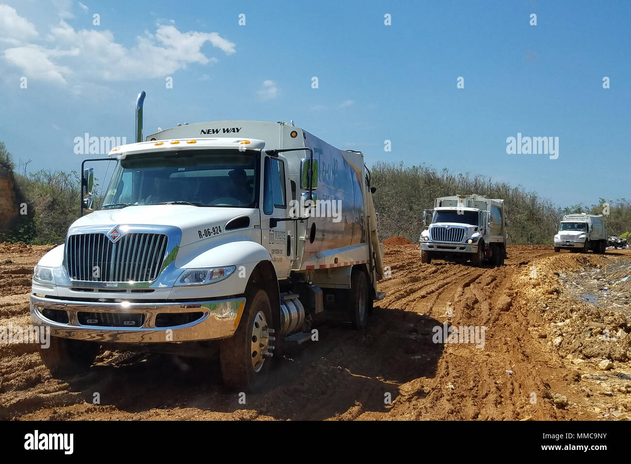Garbage trucks working local landfill hi-res stock photography and ...