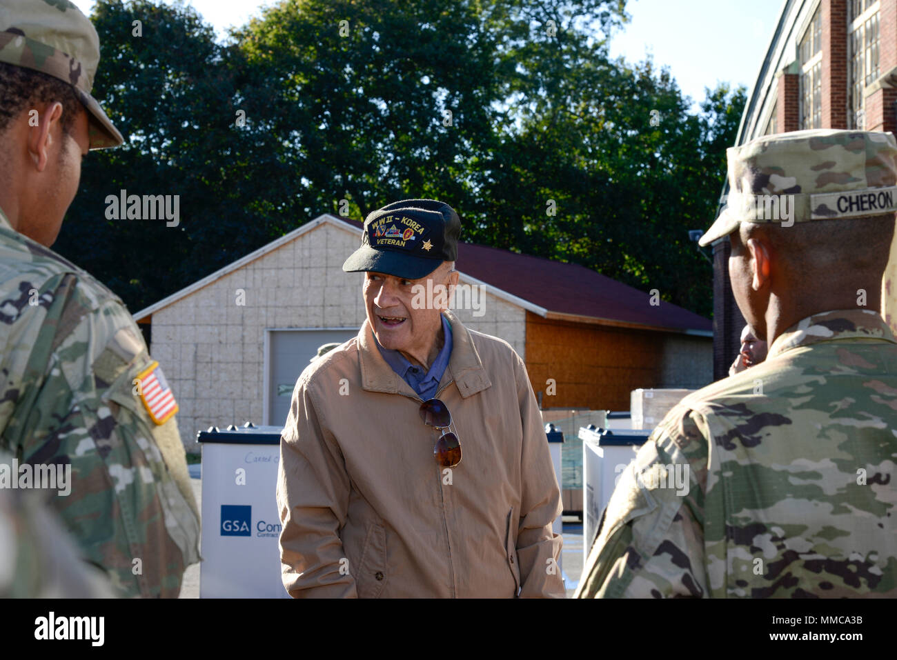 Airmen and Soldiers assigned to the New York National Guard speak with ...