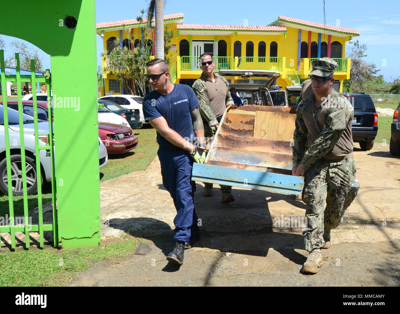 Four Coast Guardsmen, including (front left) Coast Guard Chief Petty ...