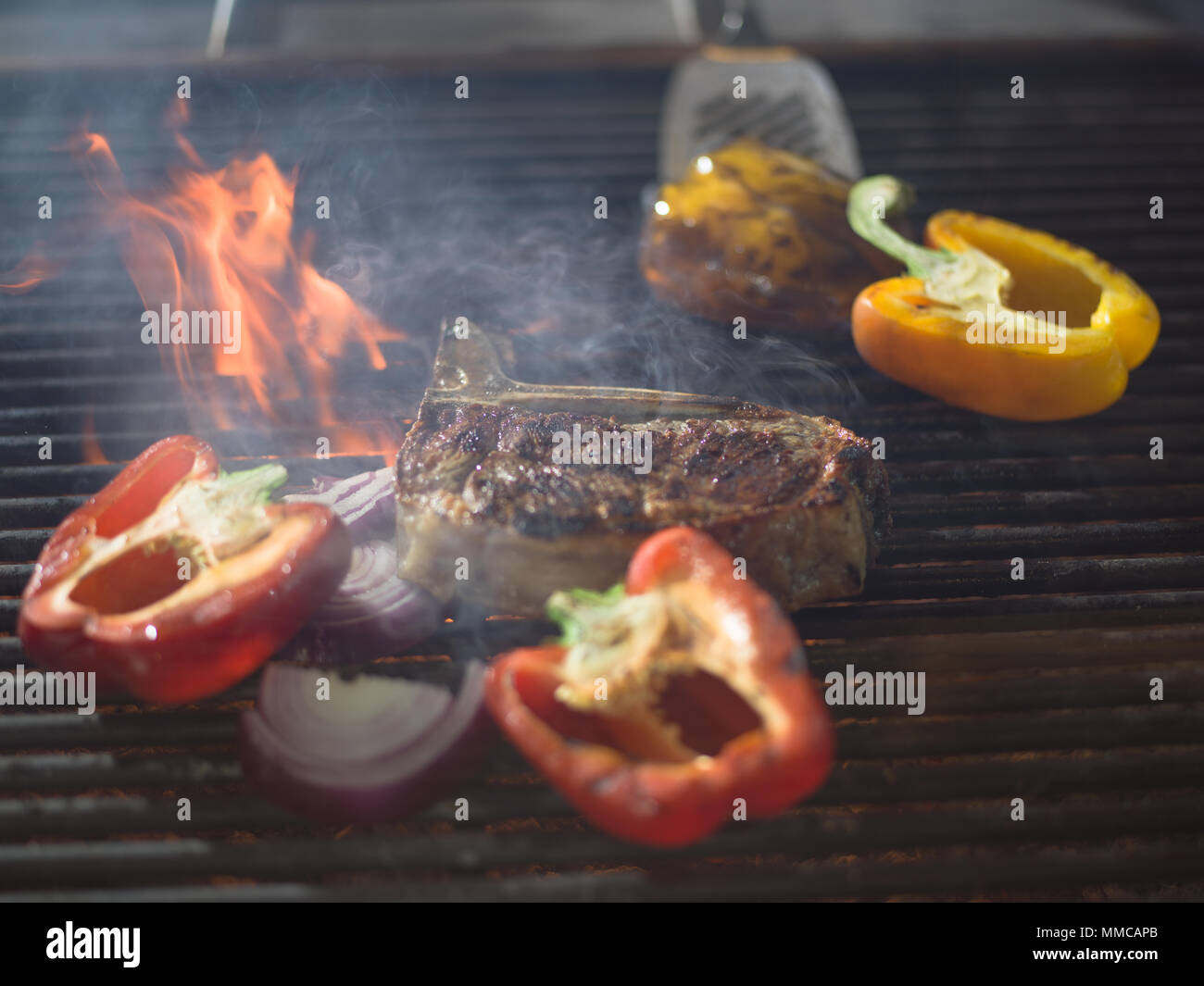 delicious grilled meat steak with vegetables on a barbecue Stock Photo ...