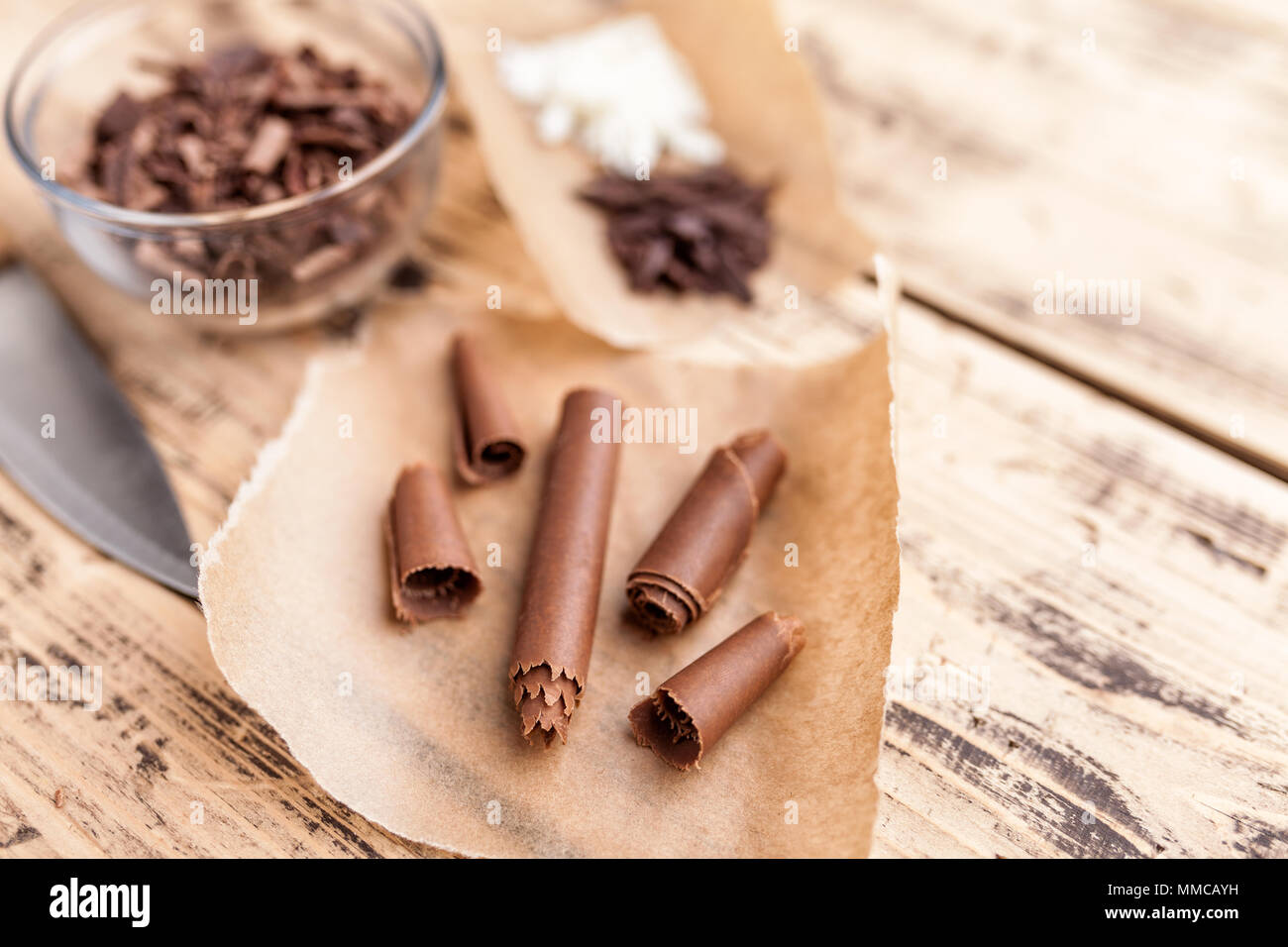 Delicious and sweet chocolate swirls on wooden background Stock Photo ...