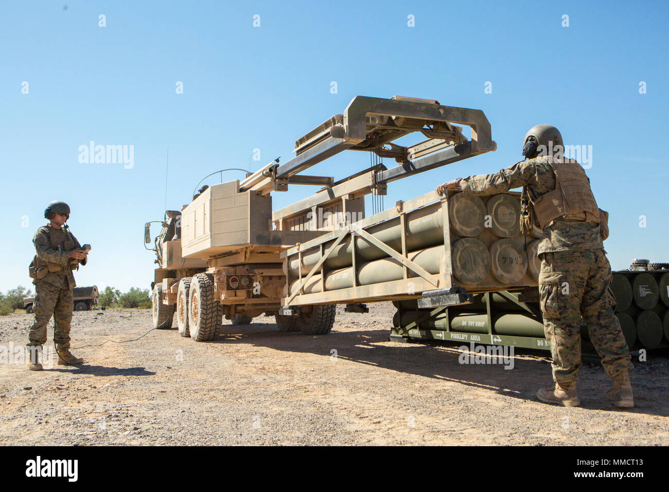 Sgt. Jansen Davis (right), a section chief with 3rd Platoon, Rocket ...