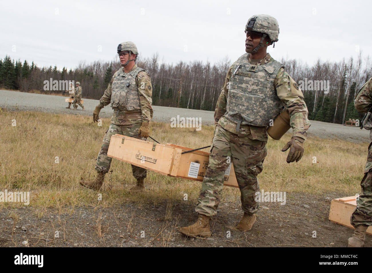 Army Spc. Chevy Yockman, left and Capt. Tyrone Norman, assigned to the ...